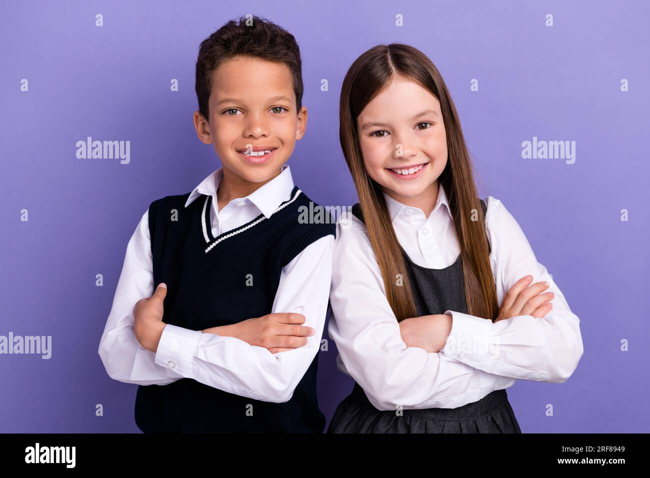 Photo of smart classmates schoolkids cross arms for new knowledge at ...