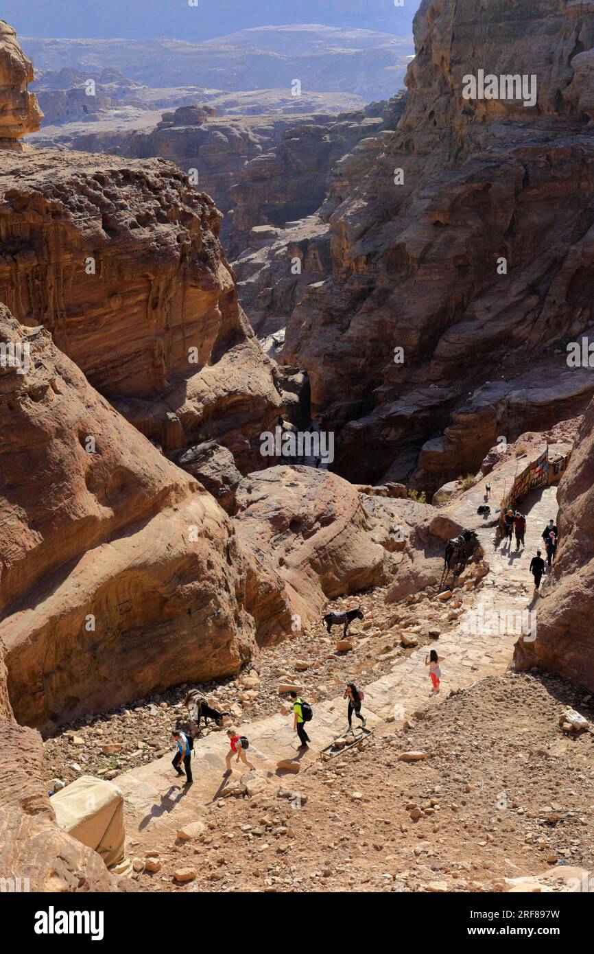 People on the Ad Deir Monastery trail down to Petra city, UNESCO World ...