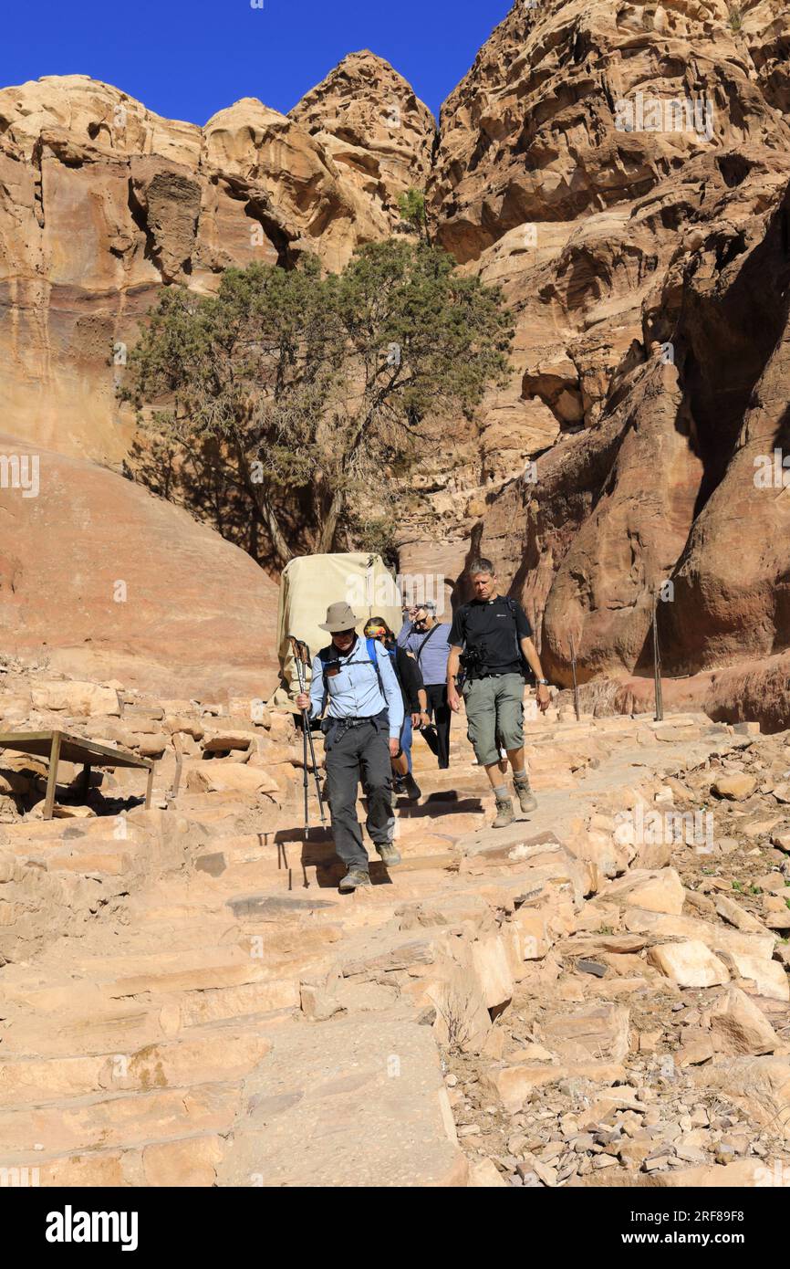 People on the Ad Deir Monastery trail down to Petra city, UNESCO World ...