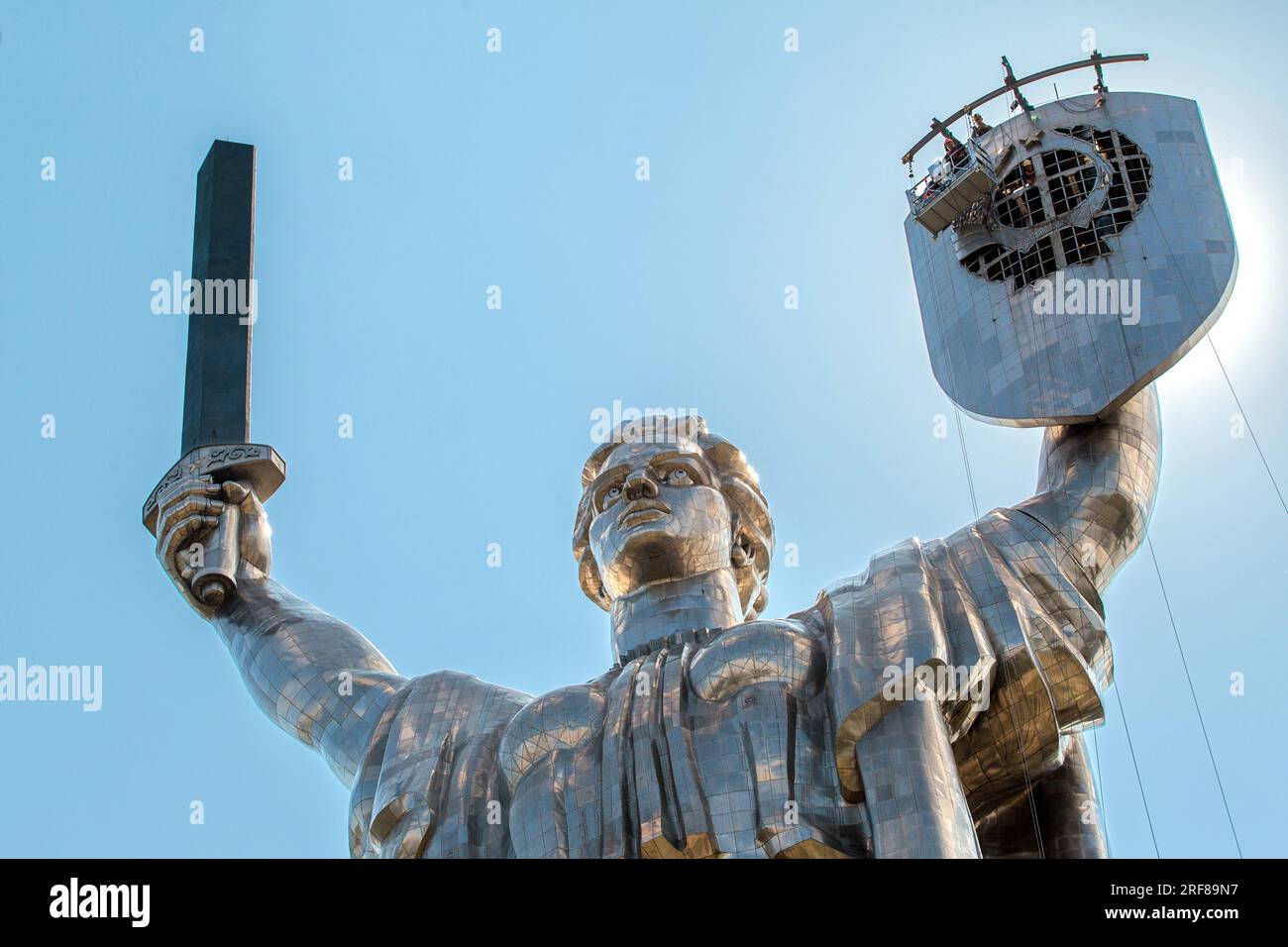 KYIV, UKRAINE - AUGUST 1, 2023 - Workers take down the State Emblem of ...