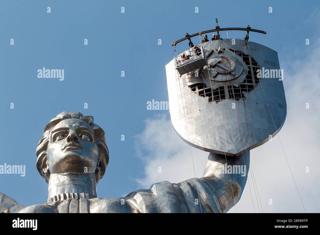 KYIV, UKRAINE - AUGUST 1, 2023 - Workers take down the State Emblem of ...
