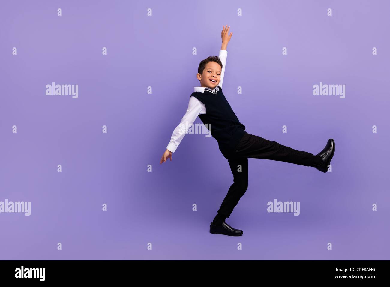 photo of positive cheerful pupils dancing on first september school day ...