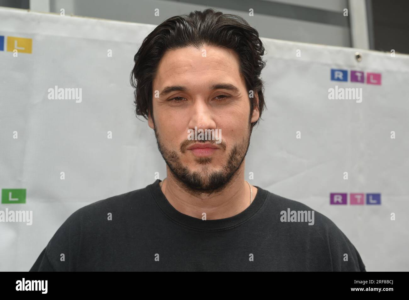 Cologne, Germany. 31st July, 2023. Actor Alexander Milo poses with the ...