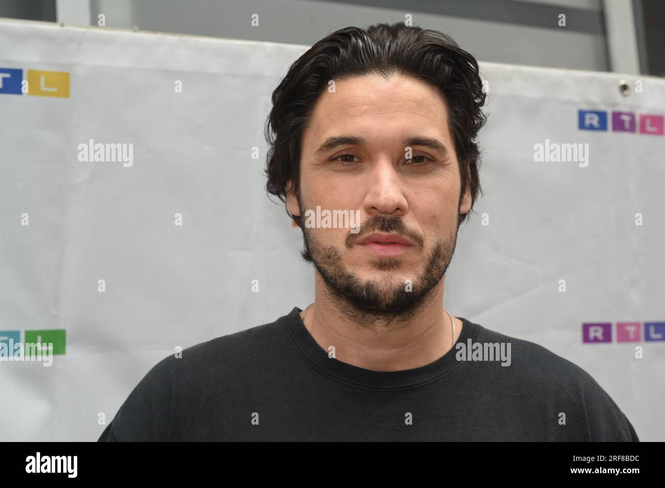 Cologne, Germany. 31st July, 2023. Actor Alexander Milo poses with the ...