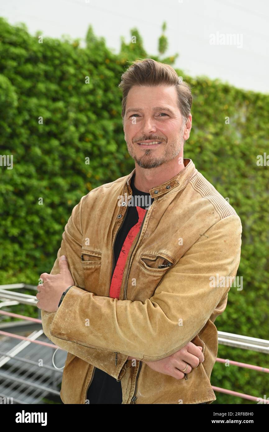 31 July 2023, North Rhine-Westphalia, Cologne: Actor Jan Ammann poses with the Unter uns star ...