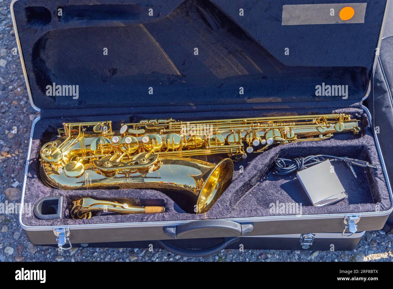 Used Gold Saxophone Music Instrument in Carrying Case Stock Photo - Alamy