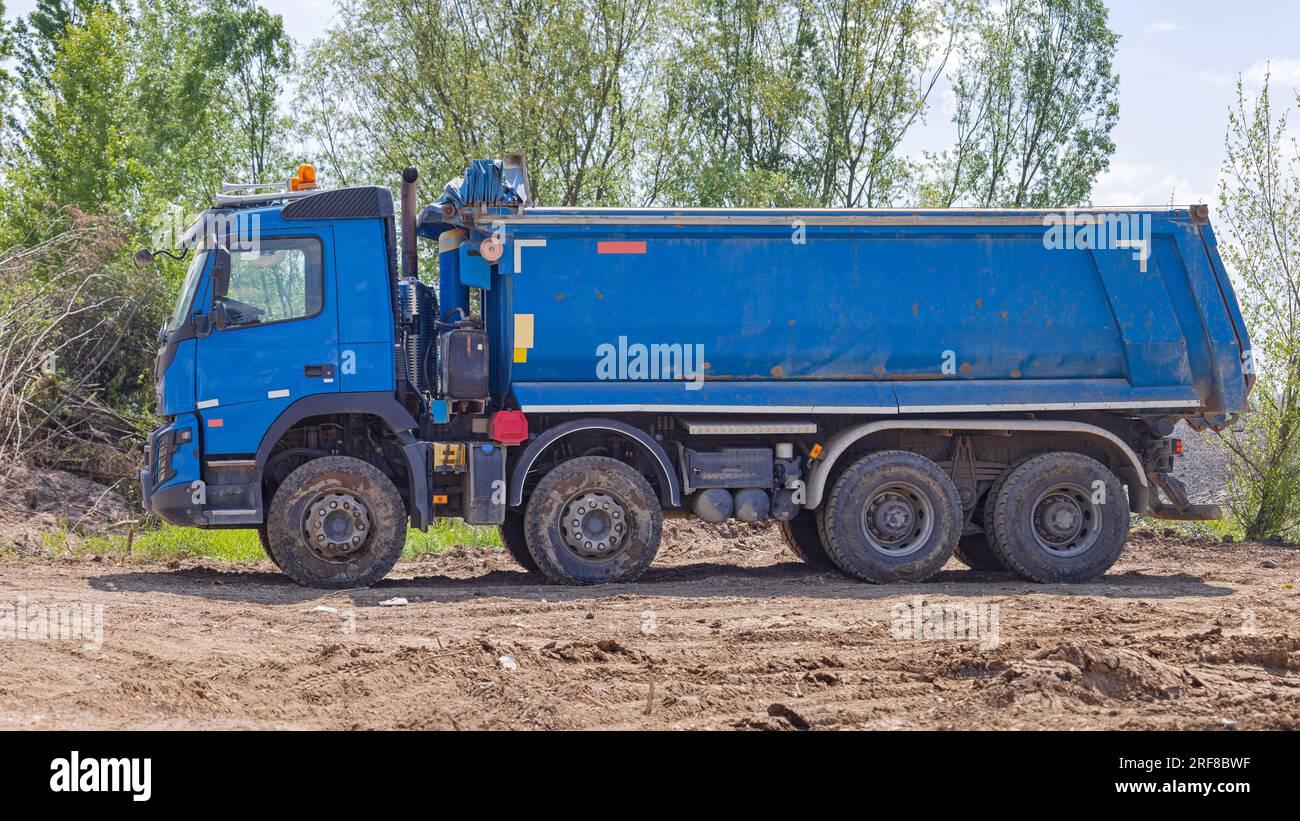 Big Blue Tipper Truck at Road Construction Site Stock Photo - Alamy