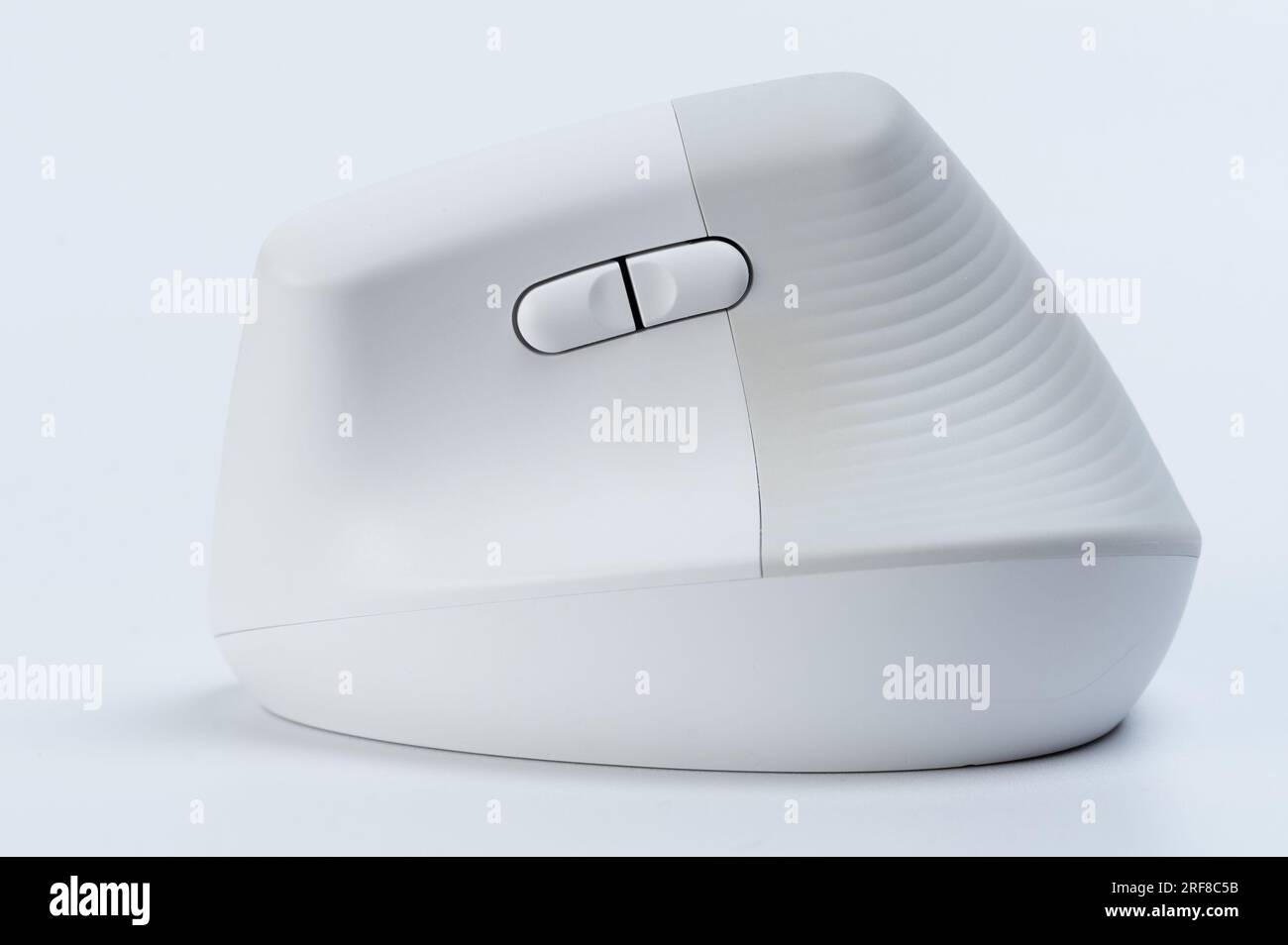 Side view of computer ergonomic mouse isolated on studio background ...