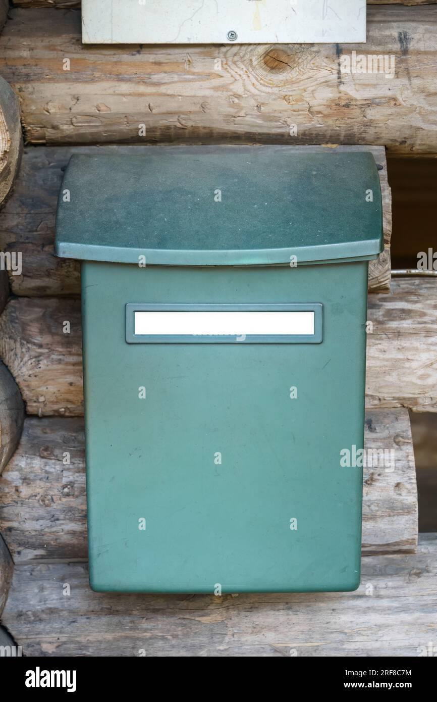 Mailbox with empty white label outside the wooden lean-to shelter in ...