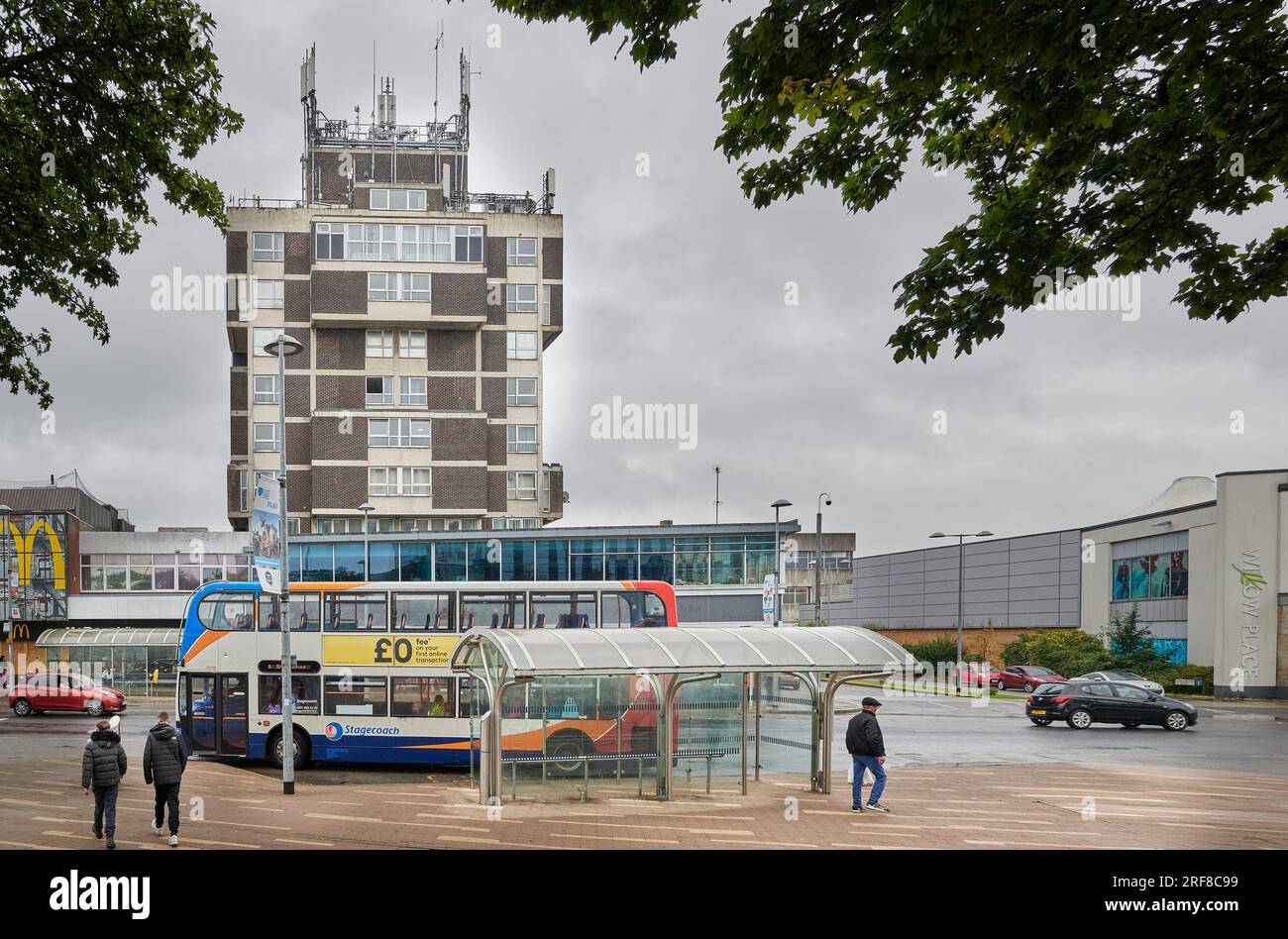 Bus on George Street at the town centre of Corby, England, on a rainy ...