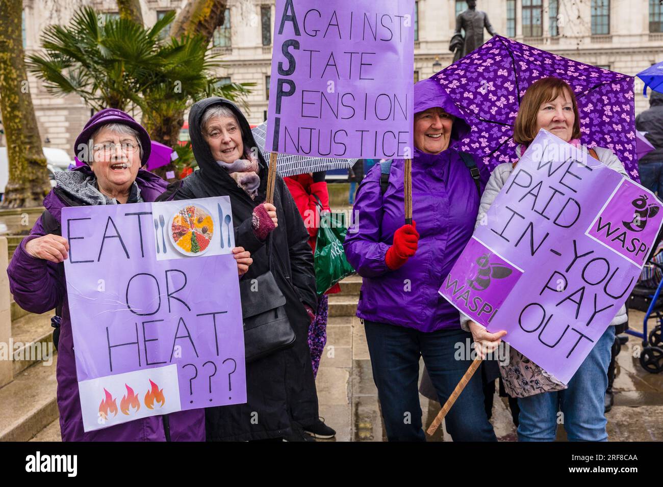 Westminster, London, UK. March 8 2023. Waspi ladies carrying placards ...