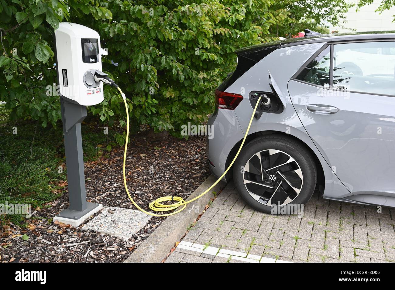 Cologne, Germany. 31st July, 2023. An electric car is charged at a ...
