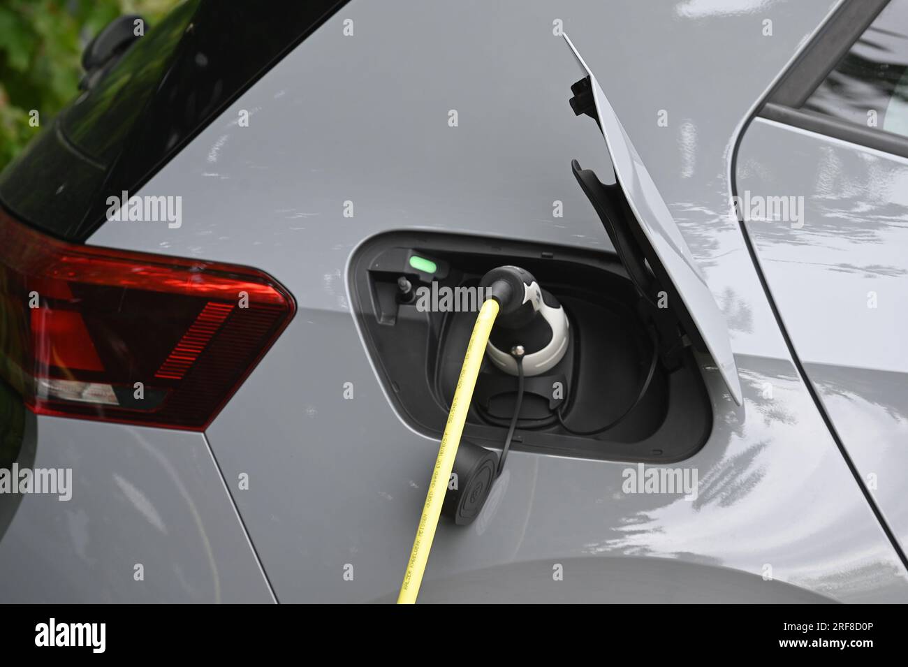 Cologne, Germany. 31st July, 2023. An electric car is charged at a ...