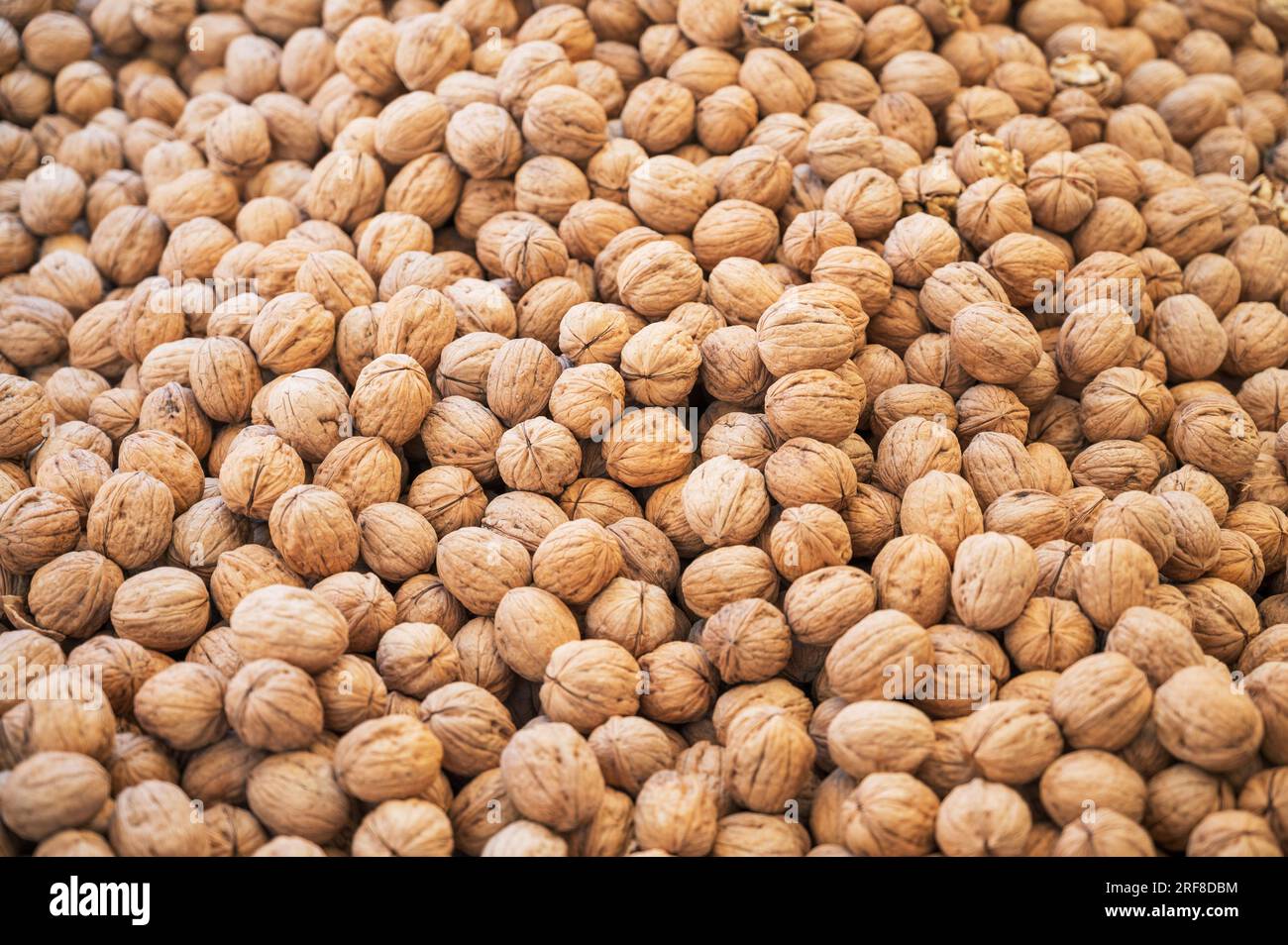 Walnut sale in the traditional farm Turkish market, a counter filled ...