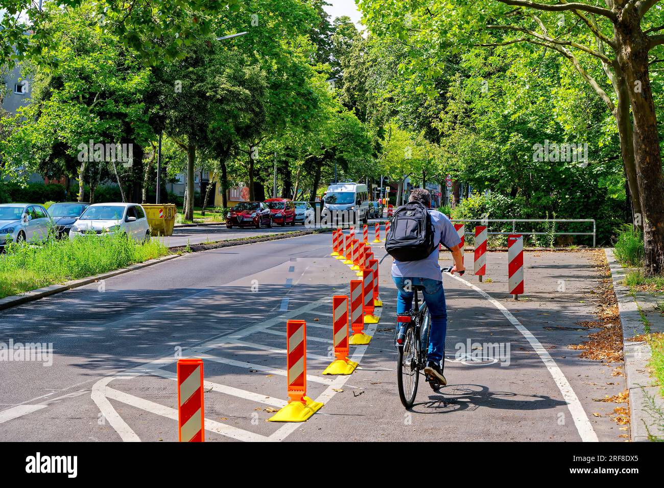 Berlin, Germany - July 30, 2023: Cyclist in a dedicated cycle lane on a ...