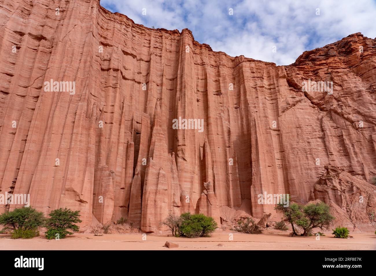 The spires of the Gothic Cathedral in the eroded red sandstone wall in ...