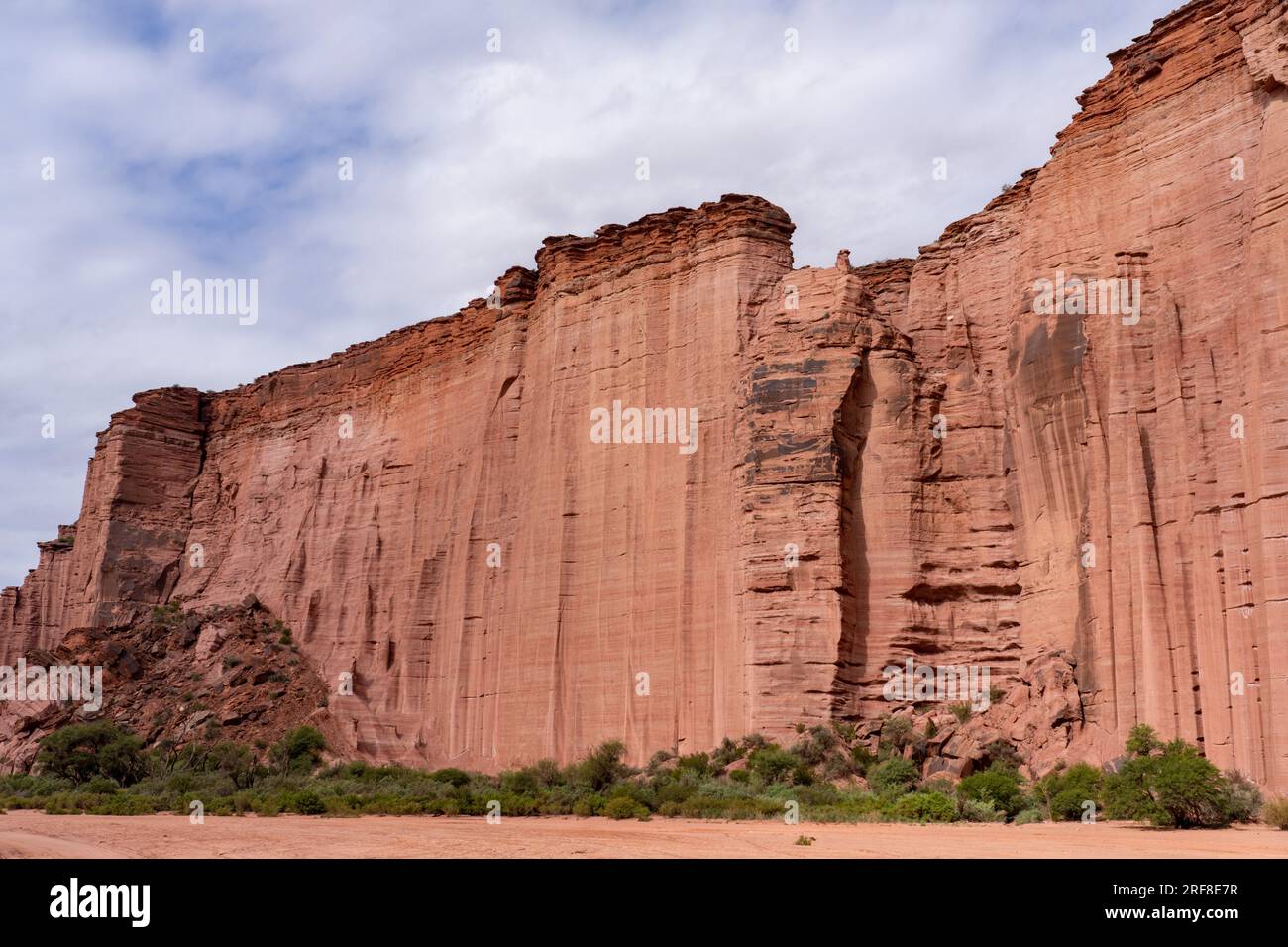 The eroded red sandstone wall of the Triassic Talampaya Formation in ...