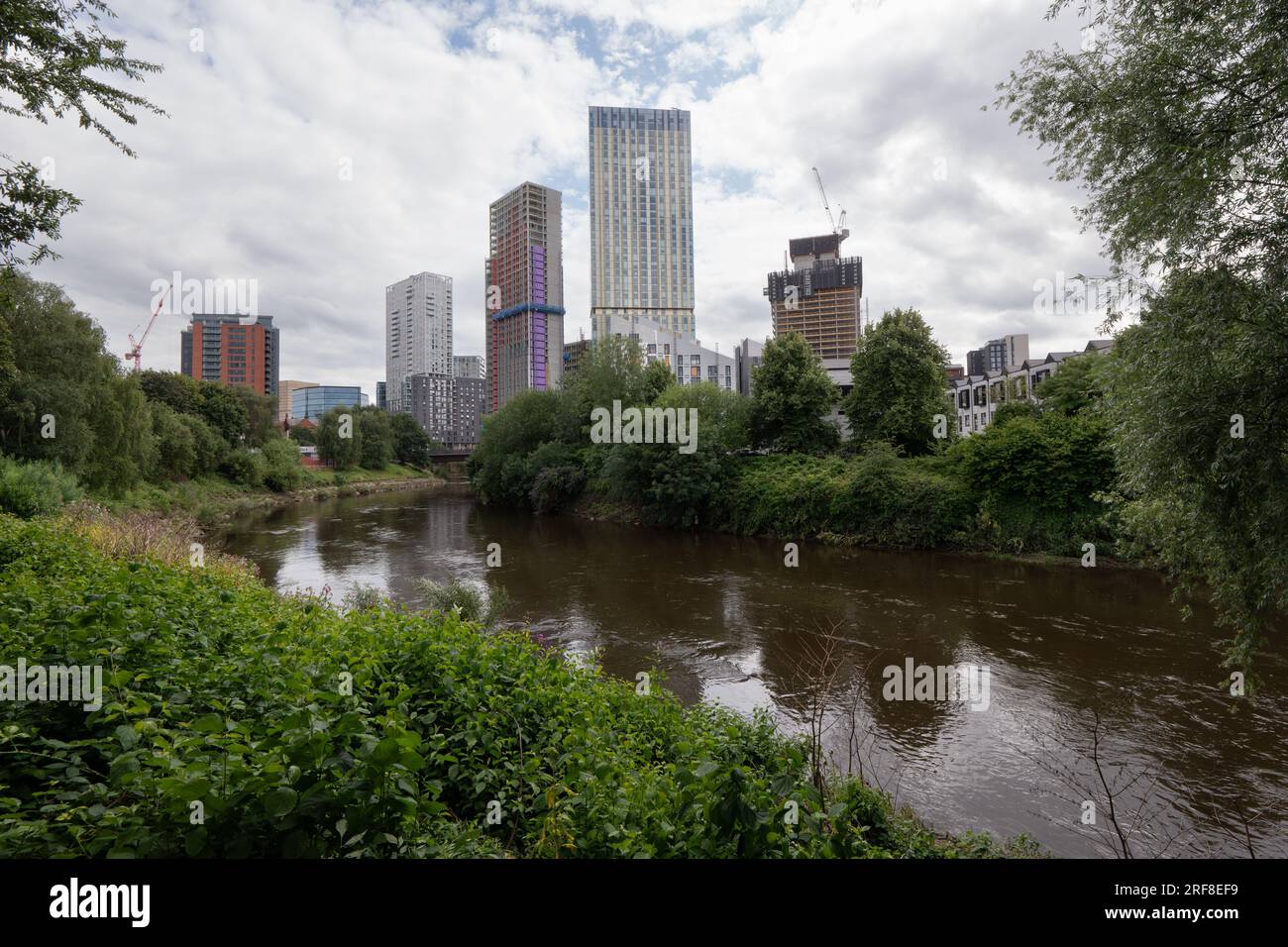 The Manchester skyline seen from the river Irwell which divides ...