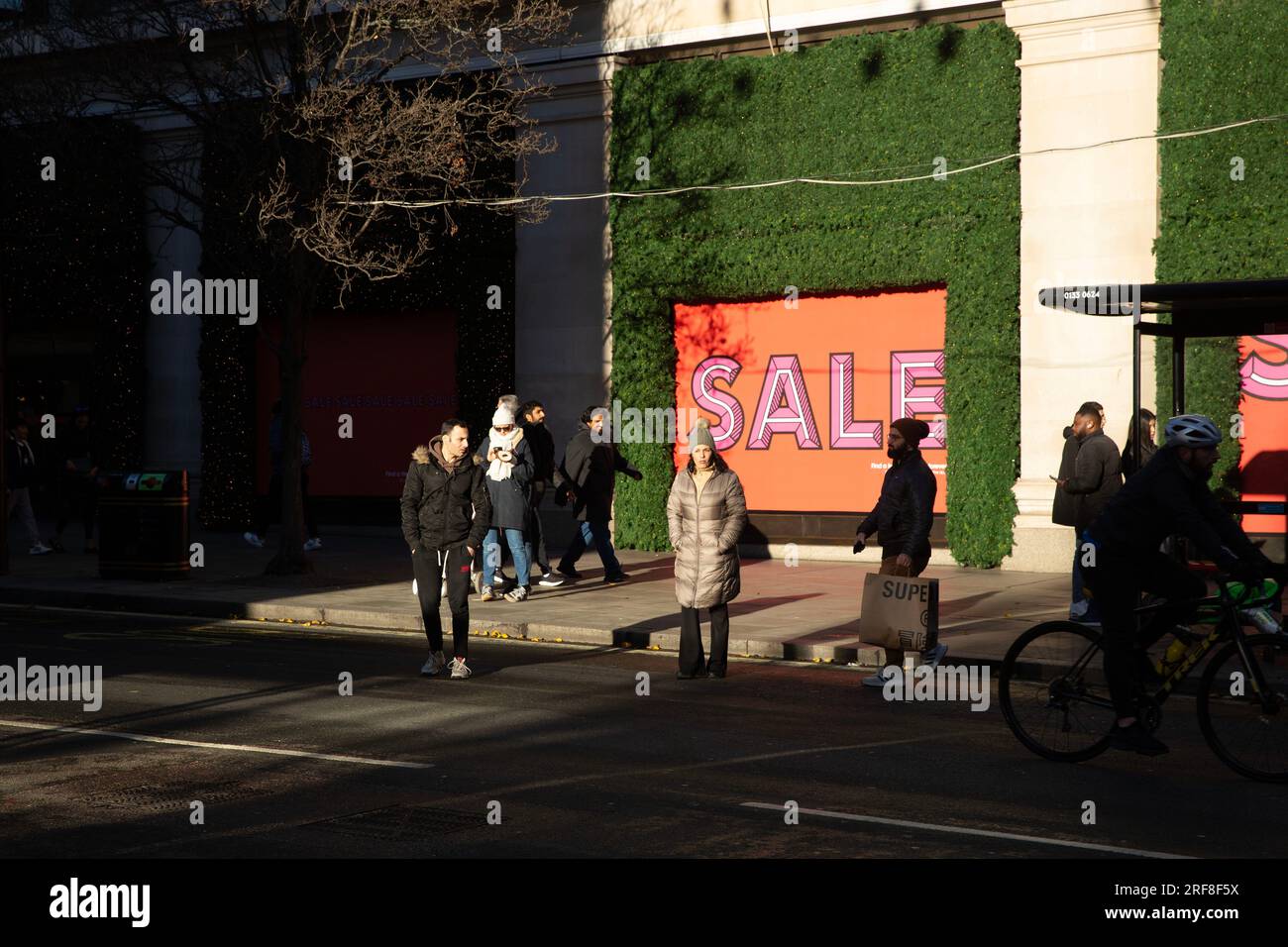 A ‘Sale’ logo is seen outside Selfridges store as people walk on Oxford ...