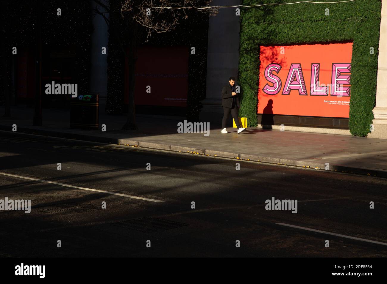 A ‘Sale’ logo is seen outside Selfridges store as people walk on Oxford ...