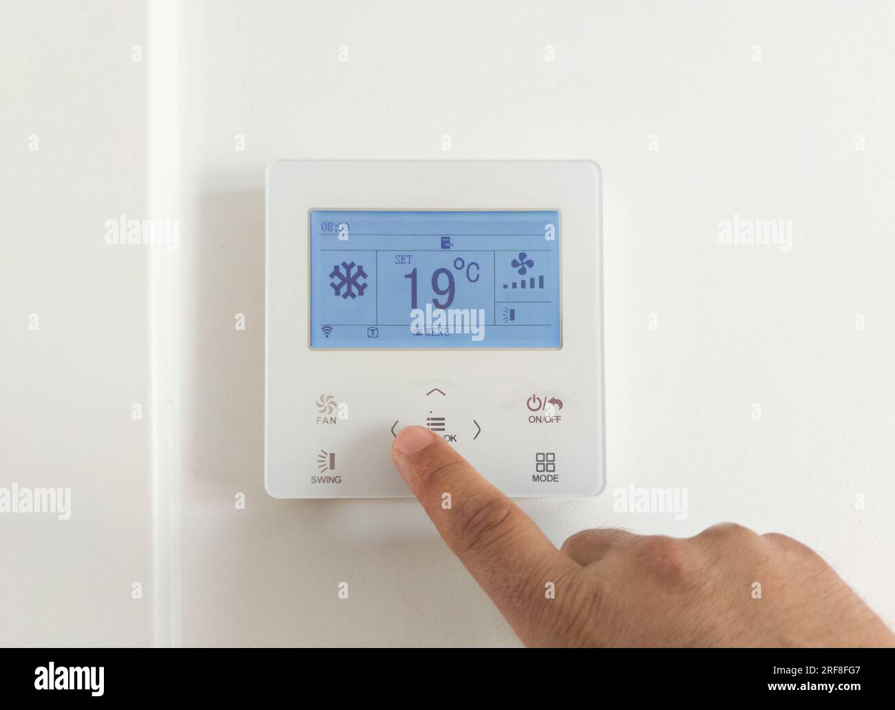 Adjusting room climate control with electronic screen. 19 celsius ...