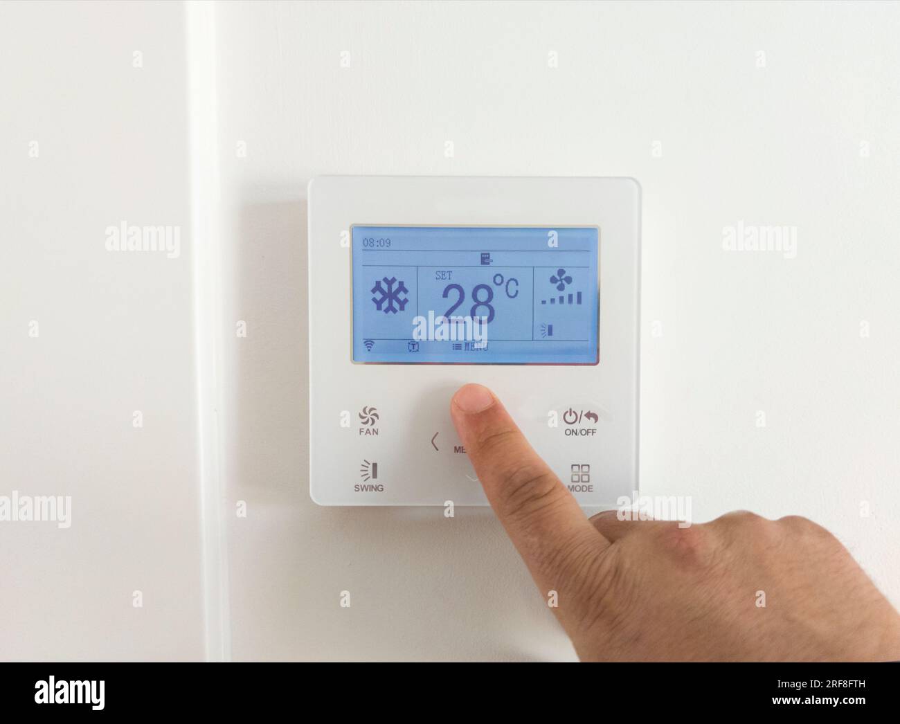 Adjusting room climate control with electronic screen. 28 celsius ...