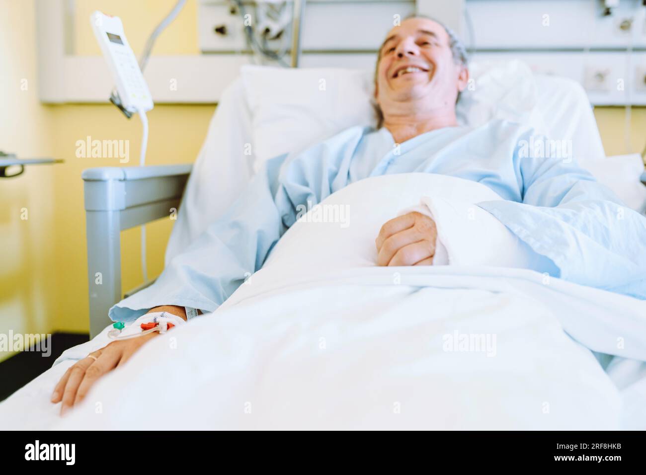 Male patient after injury or surgery in hospital ward Stock Photo - Alamy