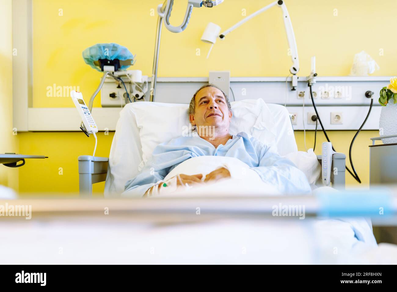 Male patient after injury or surgery in hospital ward Stock Photo - Alamy