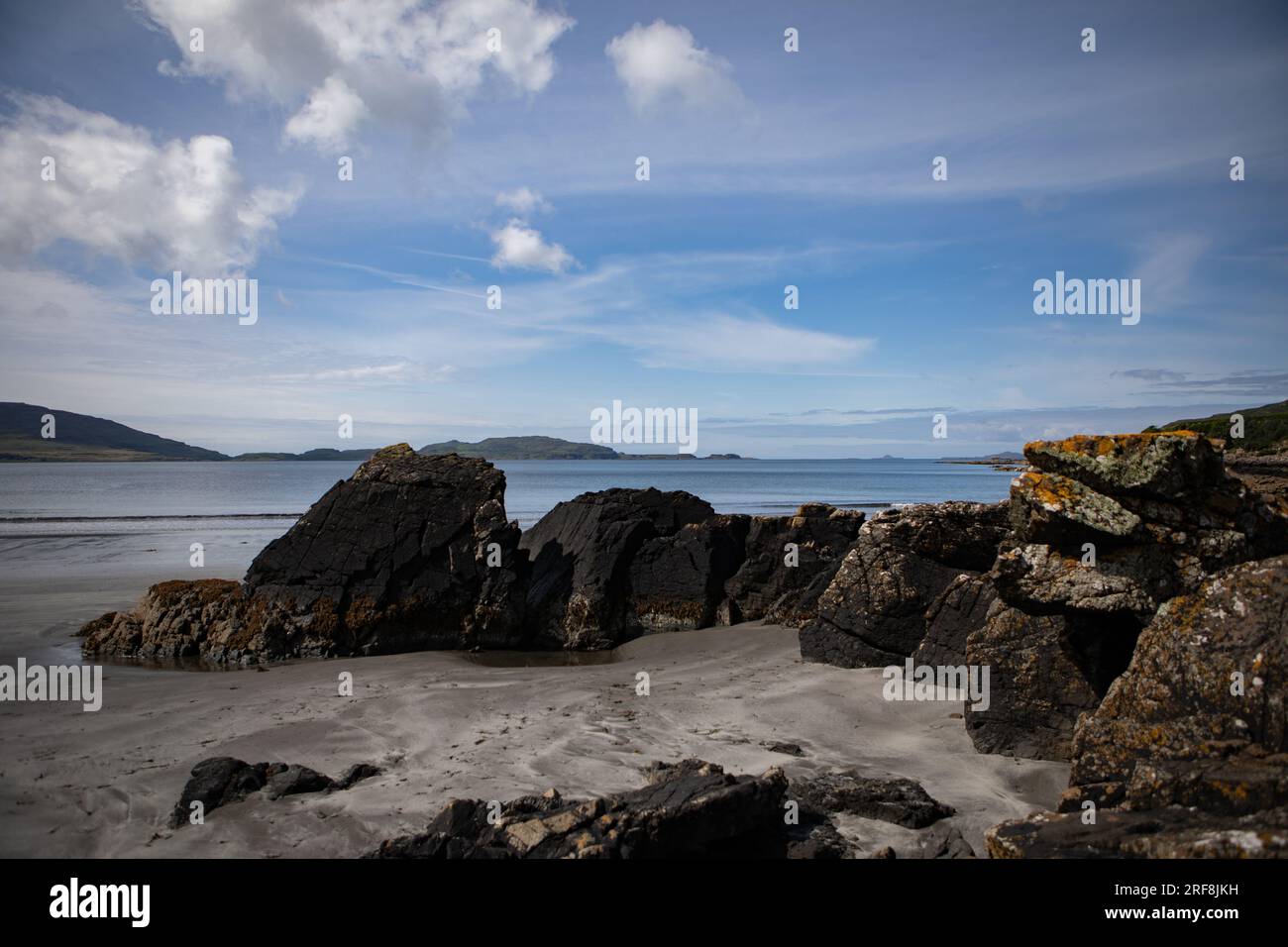 Seashore, black sand and blue sky, Traigh na Cille (Black Beach) Isle ...