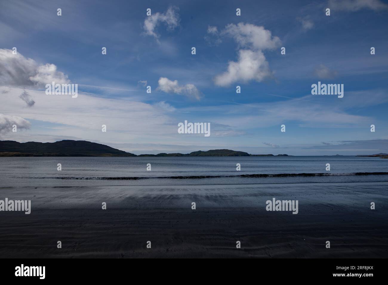 Seashore, black sand and blue sky, Traigh na Cille (Black Beach) Isle ...