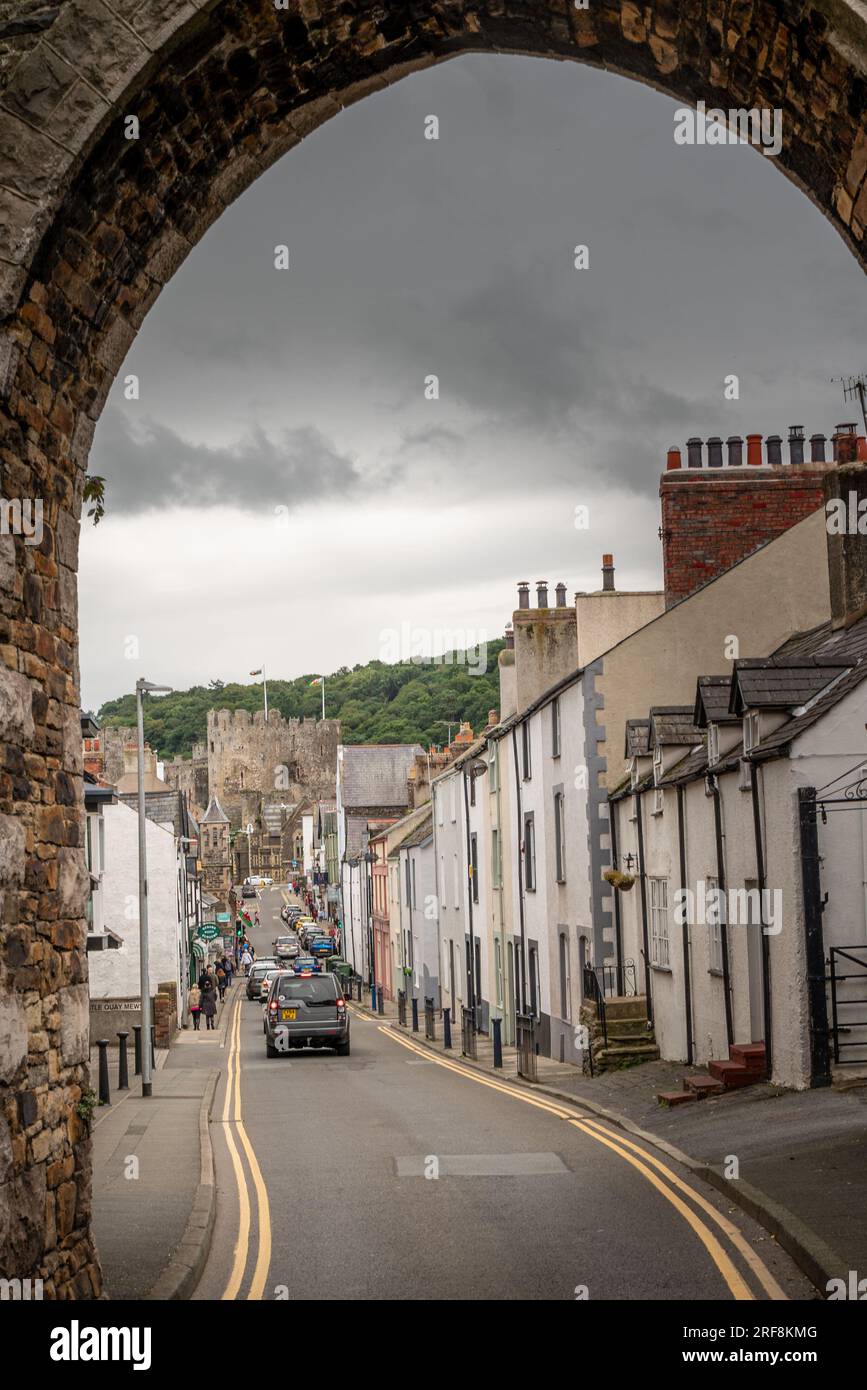 street in conwy with castle background Stock Photo - Alamy
