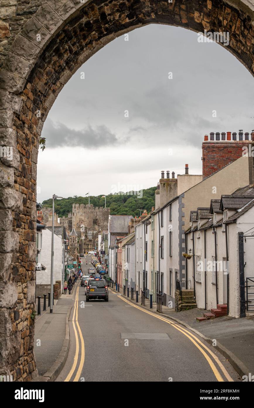 street in conwy with castle background Stock Photo - Alamy