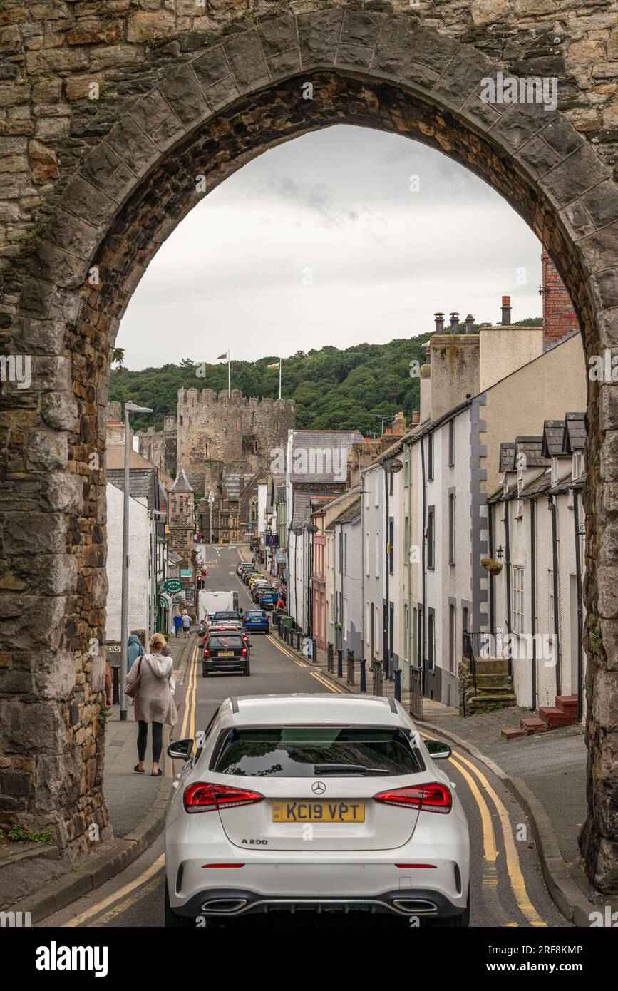 street in conwy with castle background Stock Photo - Alamy