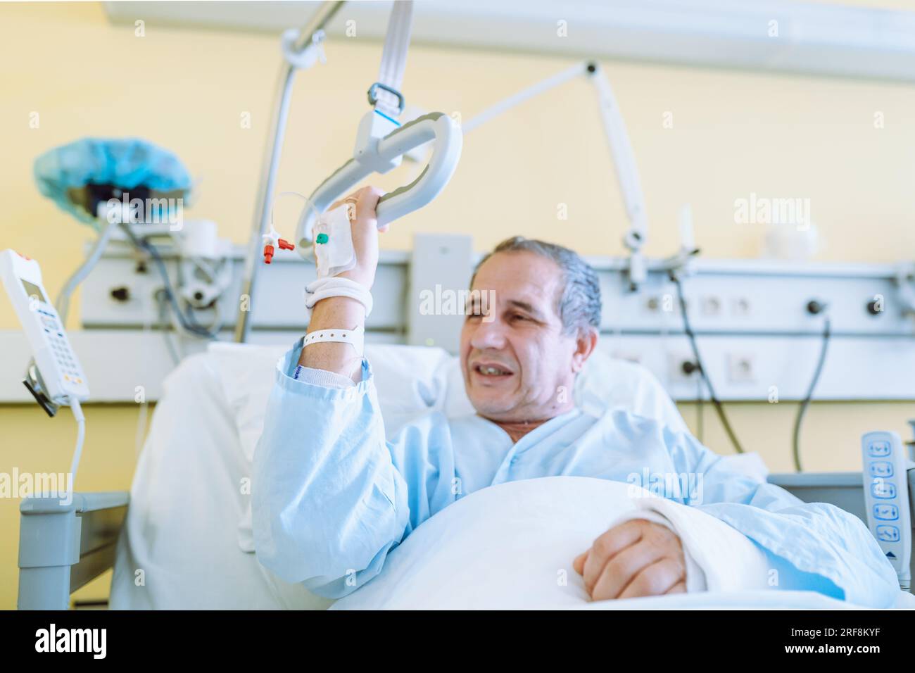 Male patient after injury or surgery in hospital ward Stock Photo - Alamy