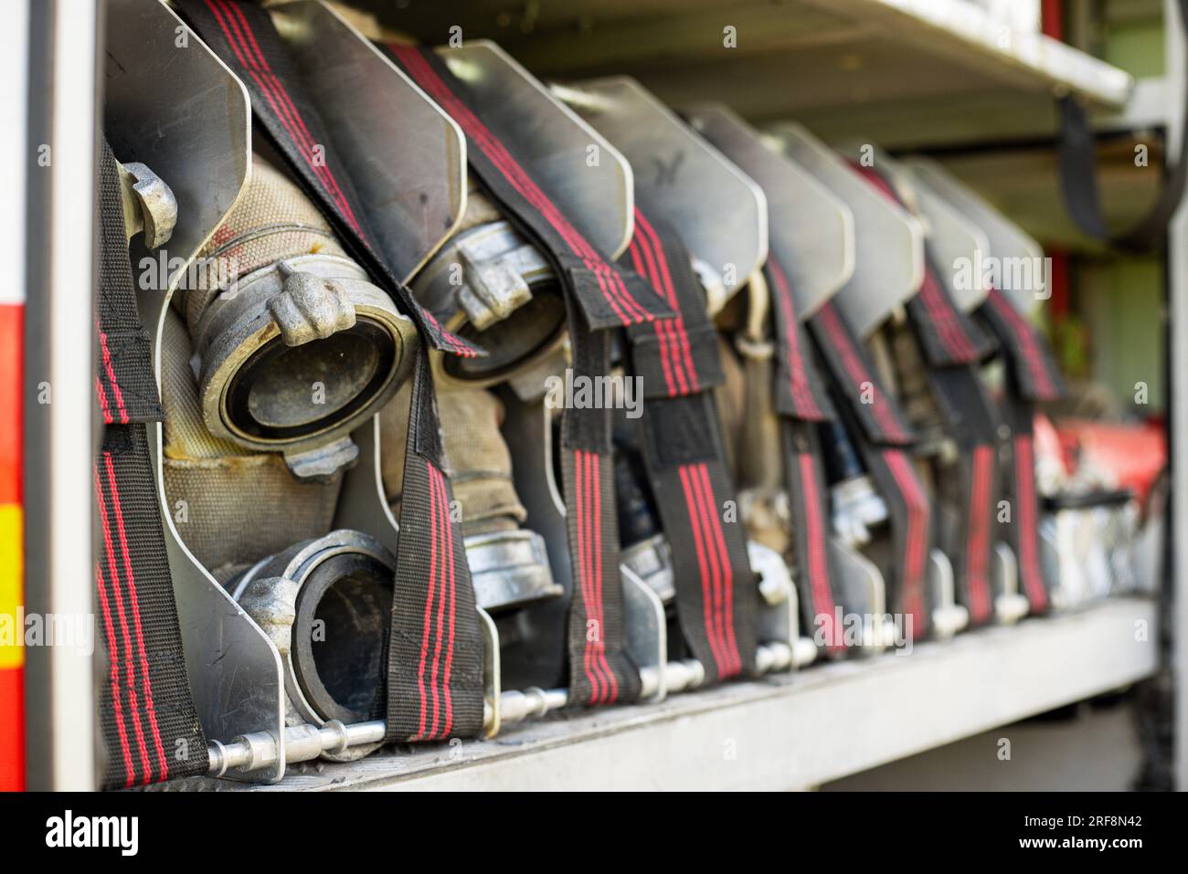 Fire truck equipment. Compartment of the rolled up fire hoses on a fire ...