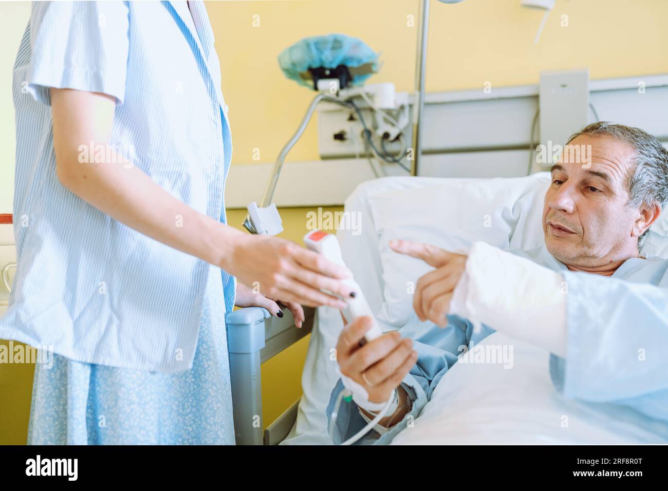 Male patient after injury or surgery in hospital ward Stock Photo - Alamy