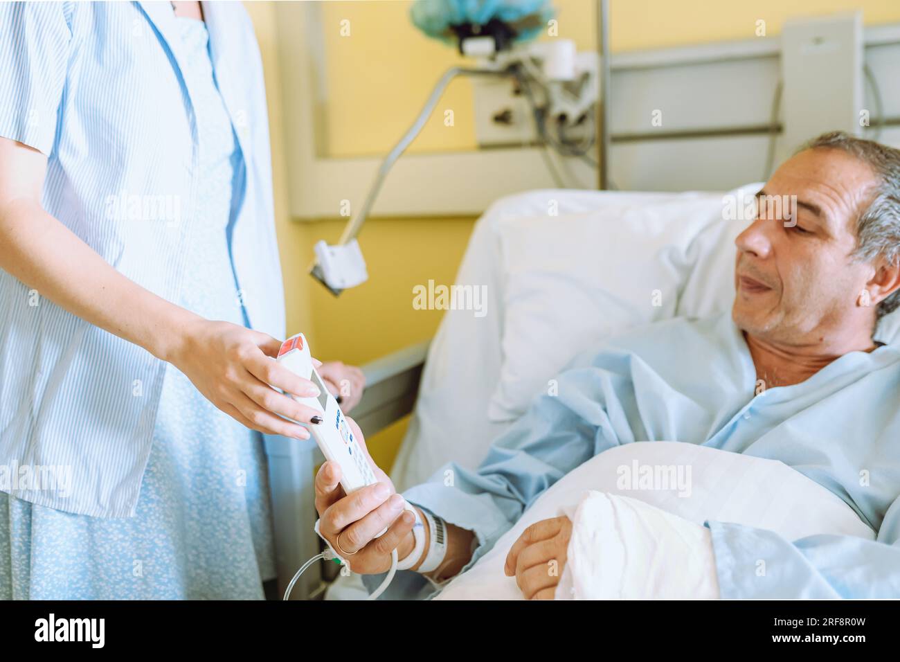 Male patient after injury or surgery in hospital ward Stock Photo - Alamy