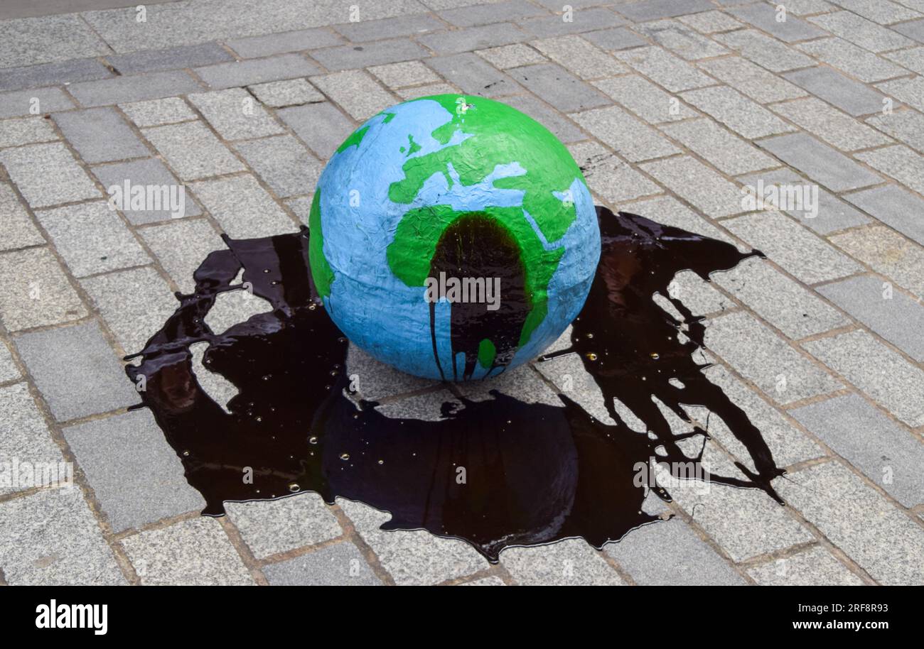 London, UK. 23rd May 2023. Fake oil spilled over 'Earth'. Extinction ...