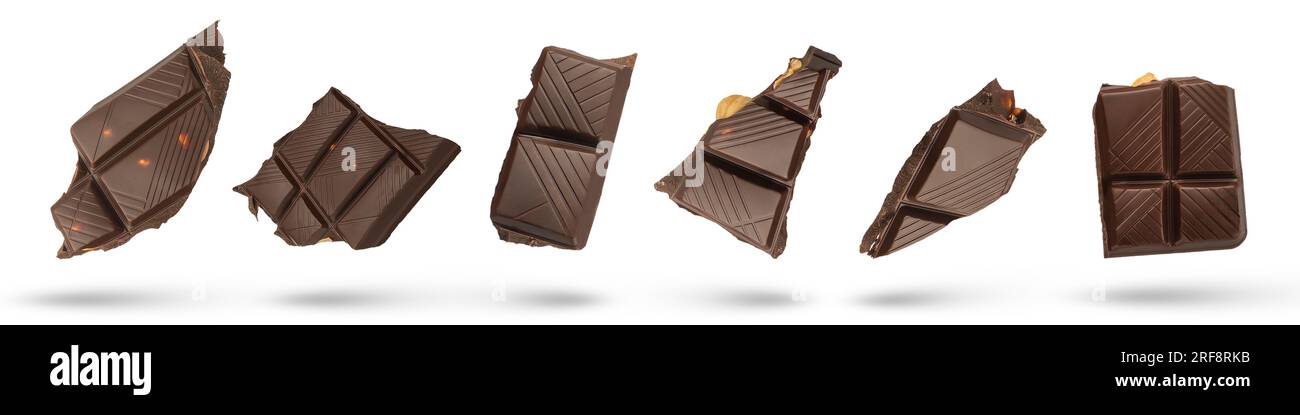 Slices of milk chocolate. Chocolate on a white isolated background ...