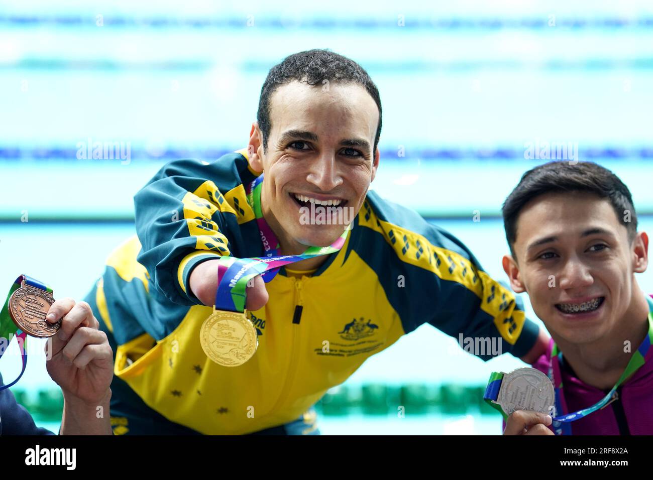 Australia's Ahmed Kelly (centre) with the gold medal after winning the ...