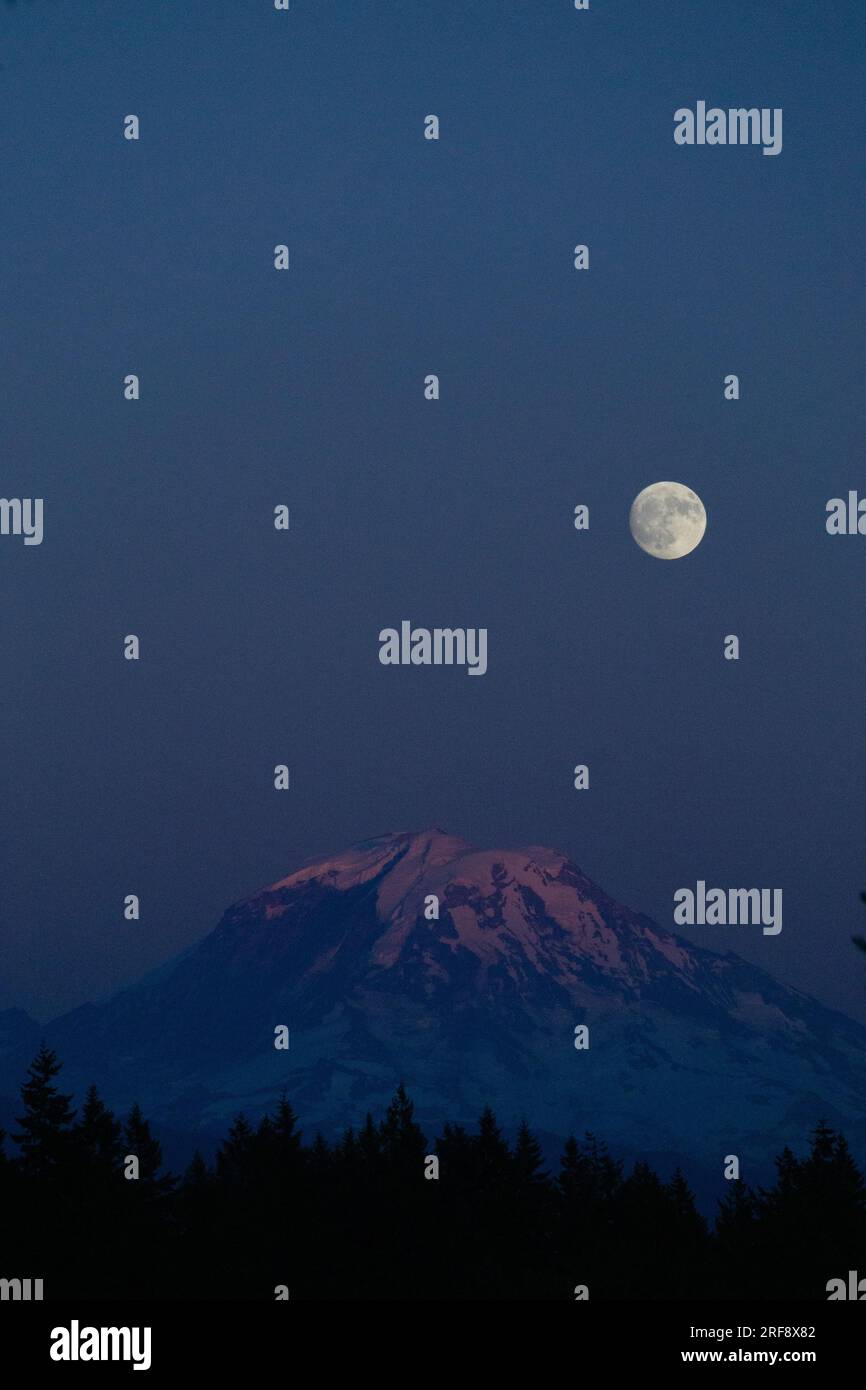 Blue Moon Rising over Mt. Rainier Stock Photo - Alamy