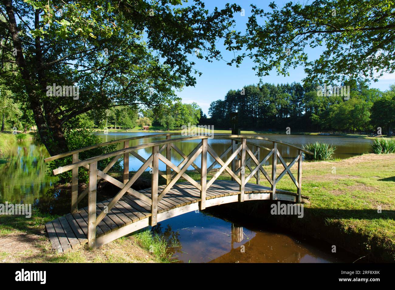 Bridge over lake in French landscape Stock Photo - Alamy