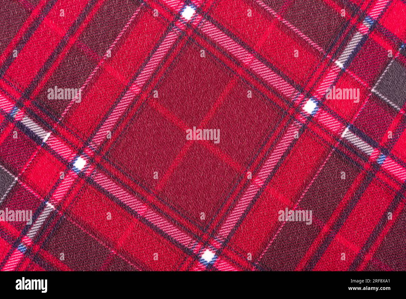 The texture of linen fabric in a large cell of red and white. Scottish ...