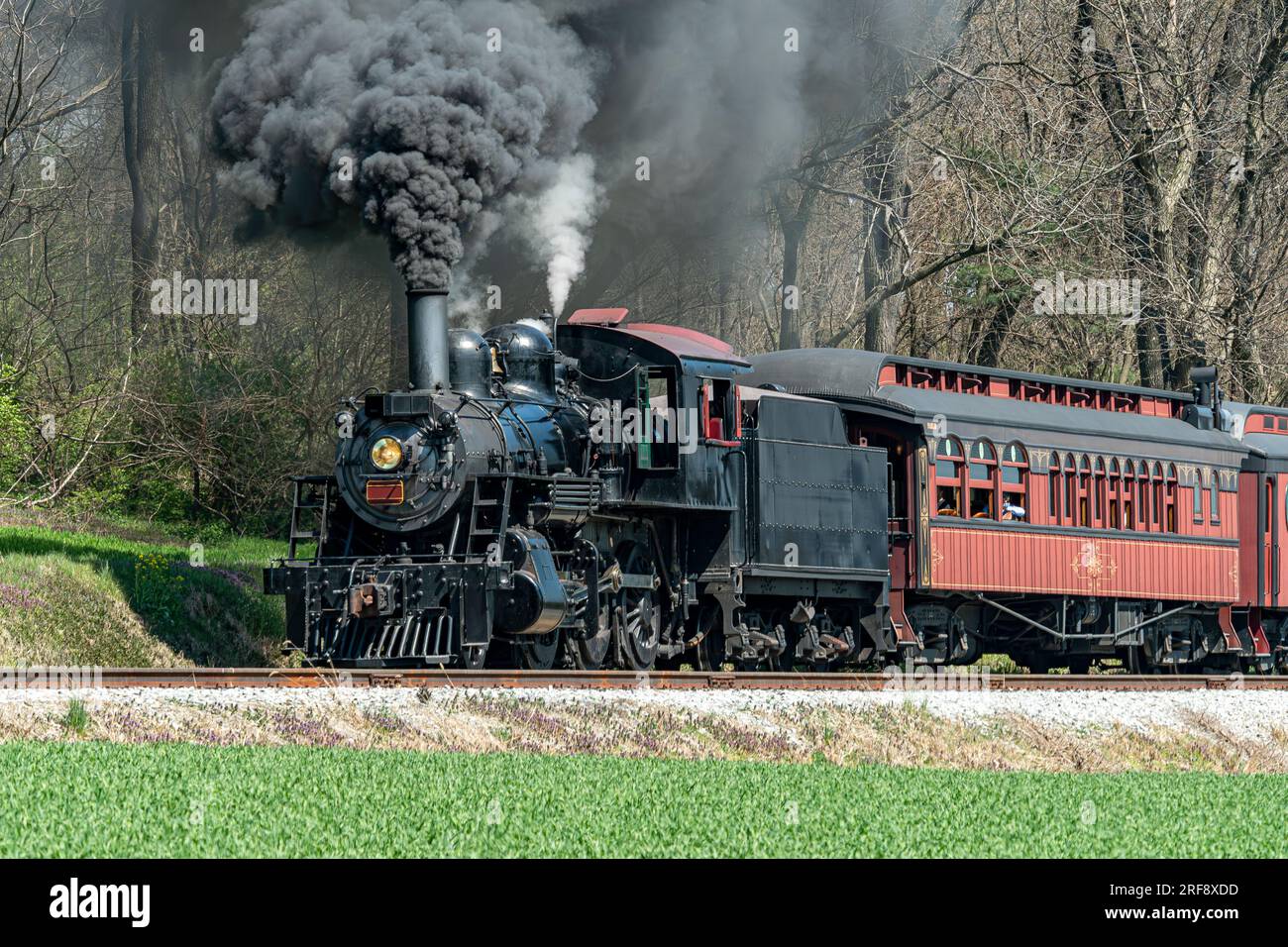 An Angled View of a Restored Steam Passenger Train Moving Slowly ...