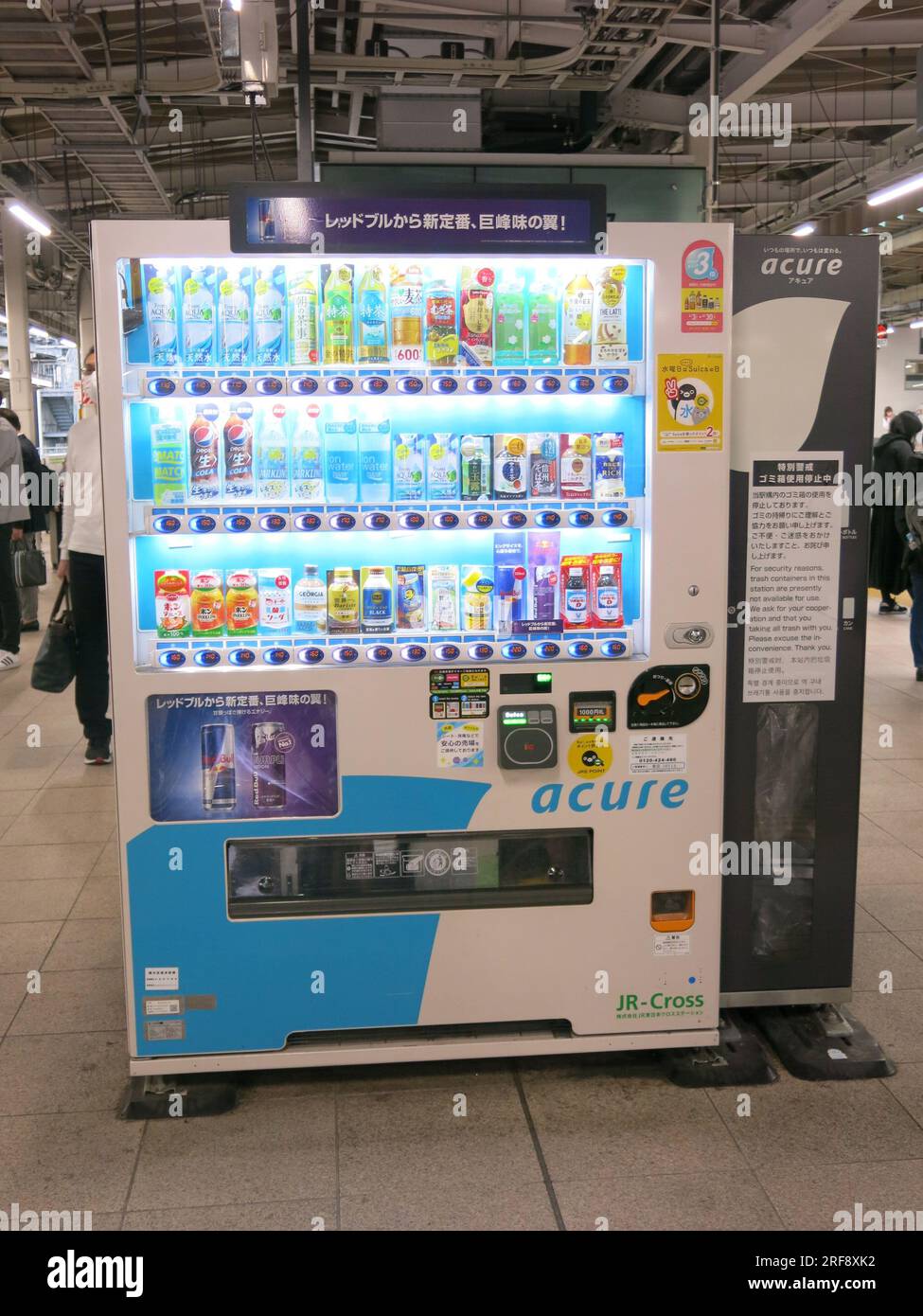An acure vending machine with a selection of cold drinks for sale at ...