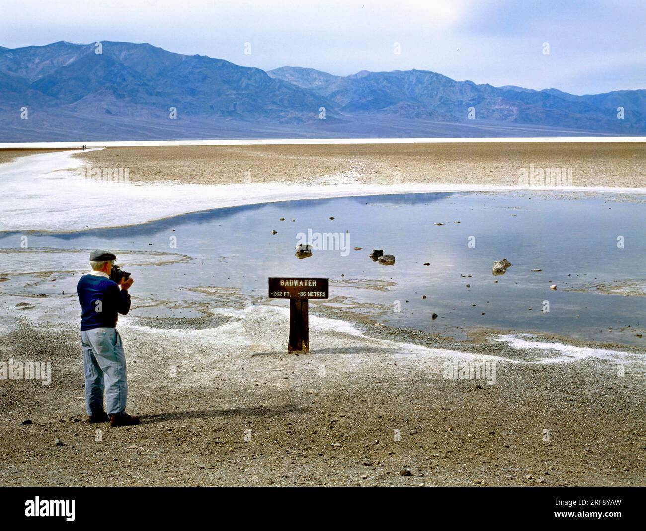BADWATER, DEATH VALLEY, USA-OCTOBER 21, 2022:Tourist taking photo near ...