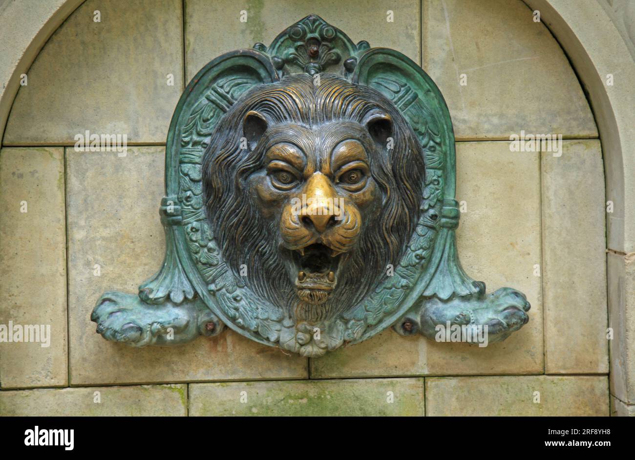 Bronze lion head. Mascaron, bas-relief, high relief of an animal in ...