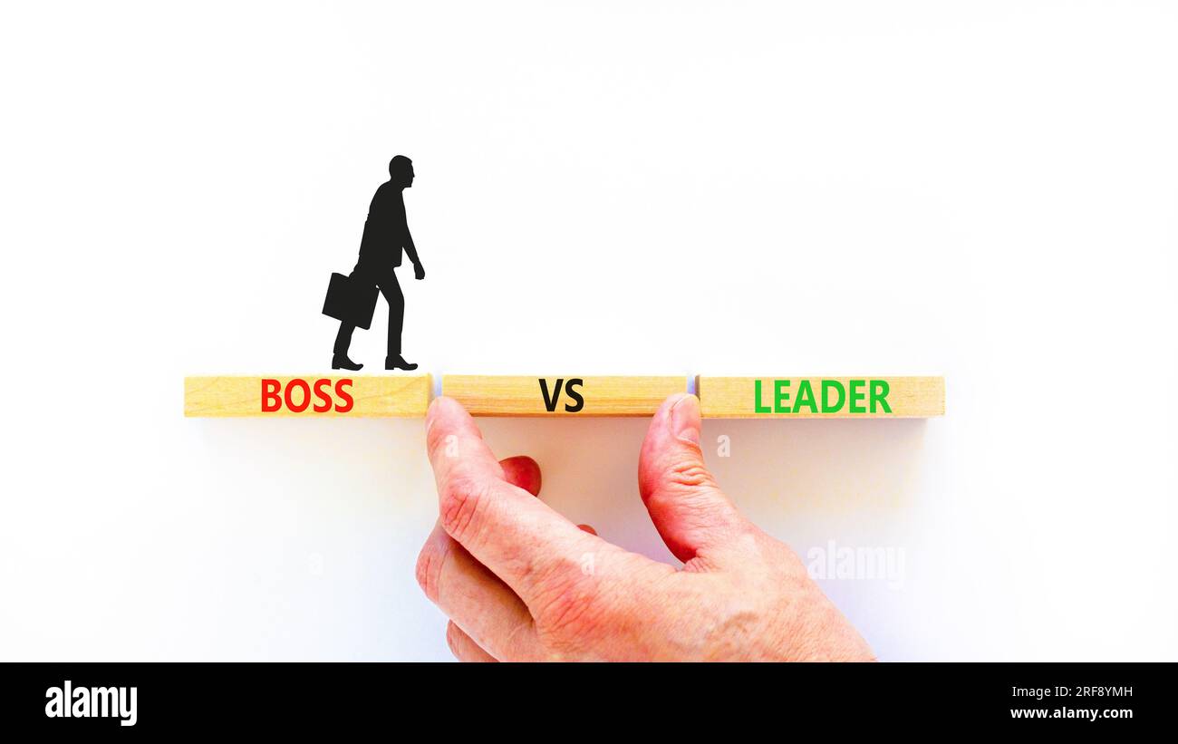 Boss vs leader symbol. Concept words Boss vs versus leader on wooden ...