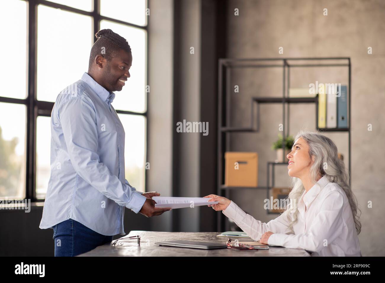 Manager Lady Giving Papers Making Career Offer To Applicant Indoor ...