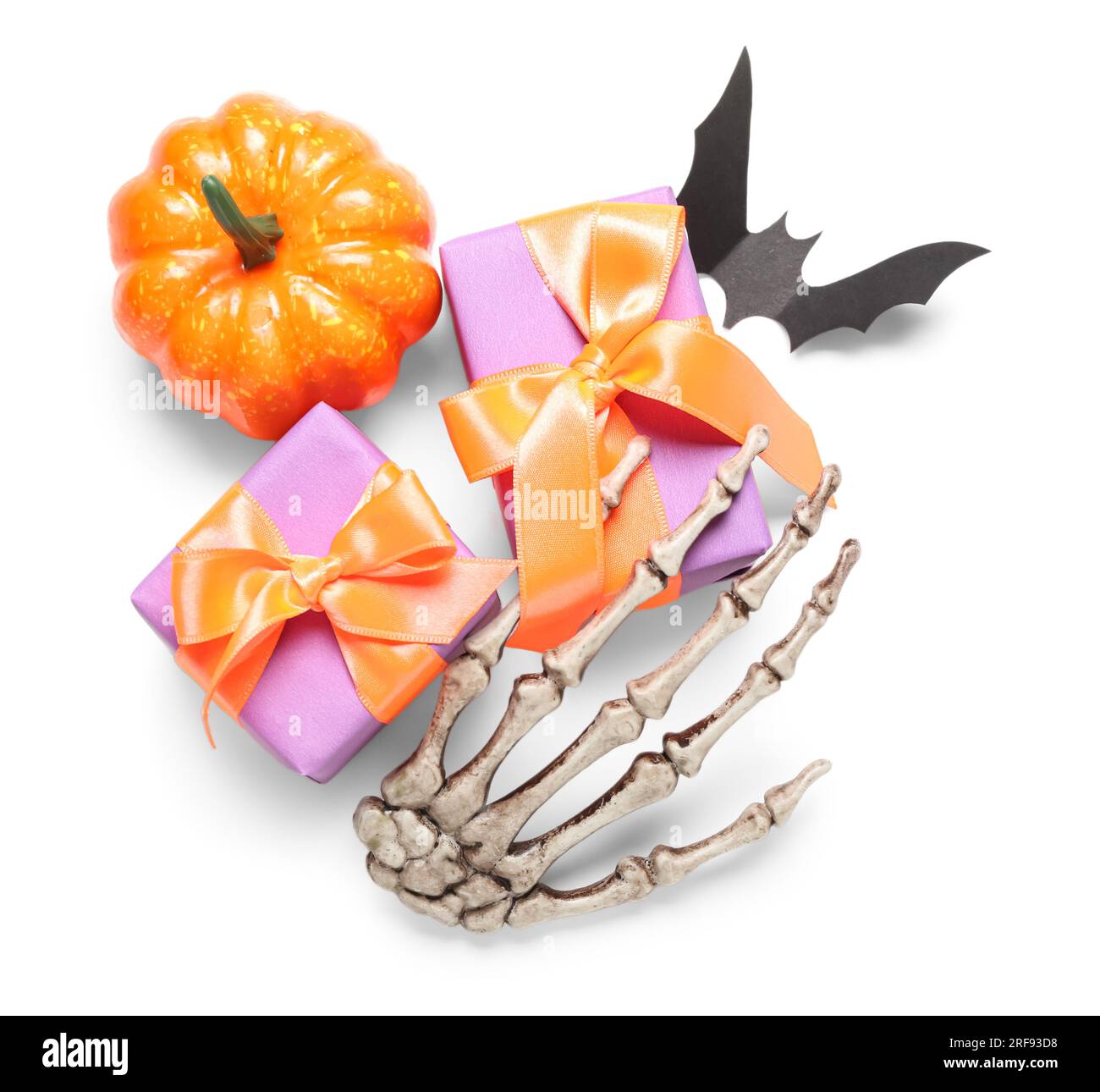 Composition with pumpkin, skeleton hand, bat and gift boxes for ...